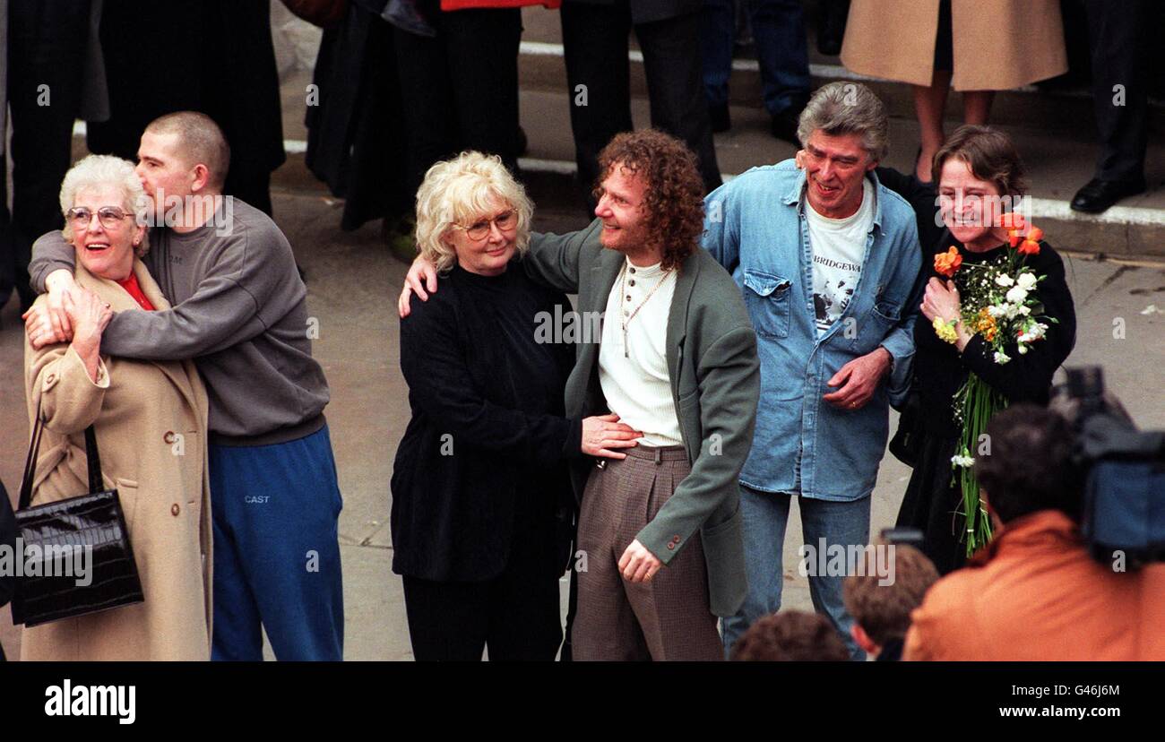 Ann Skett is kissed by son Vincent Hickey, (far left) as Michael Hickey ...