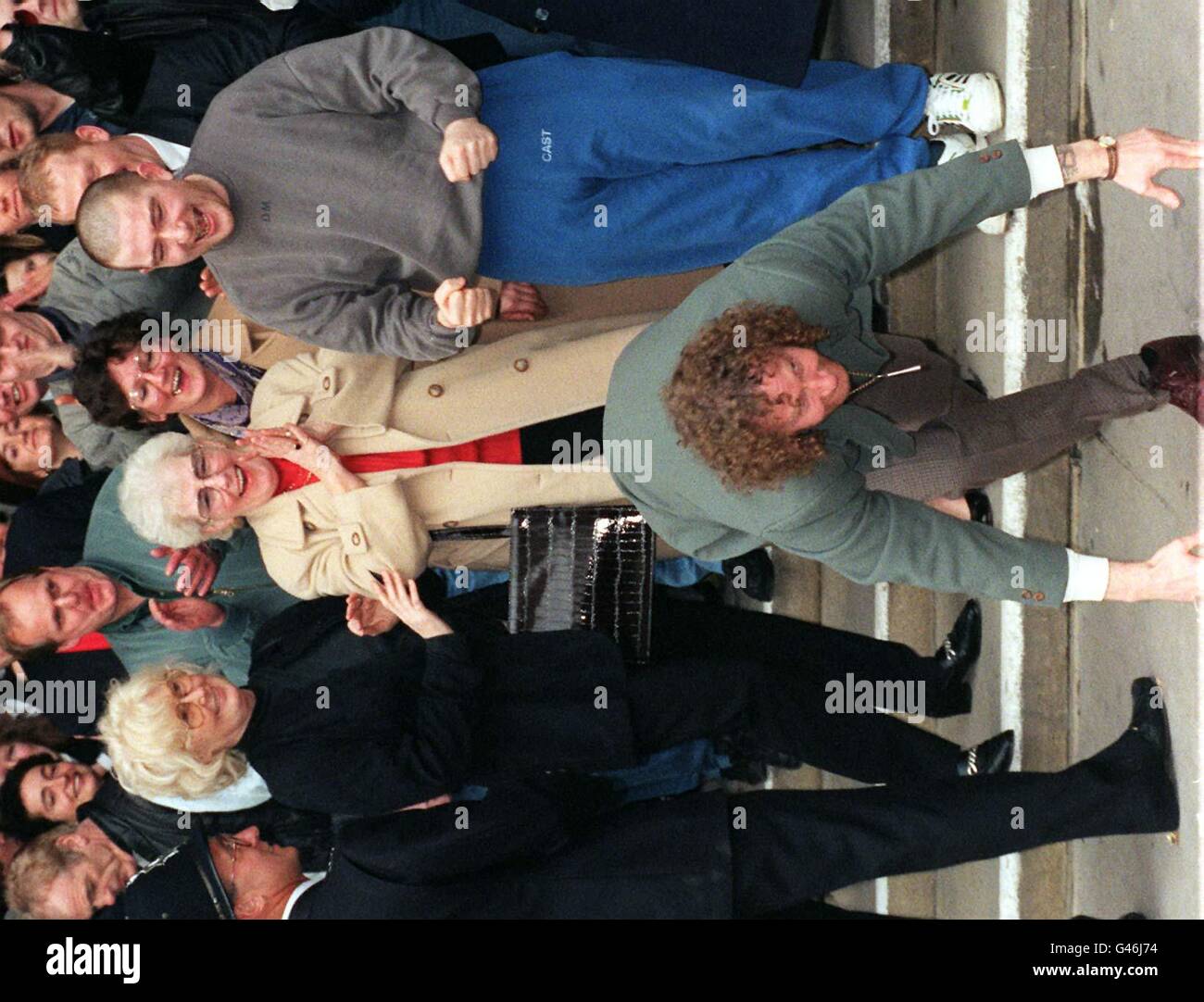 As Michael Hickey bends down to kiss the pavement, his mother Ann ...