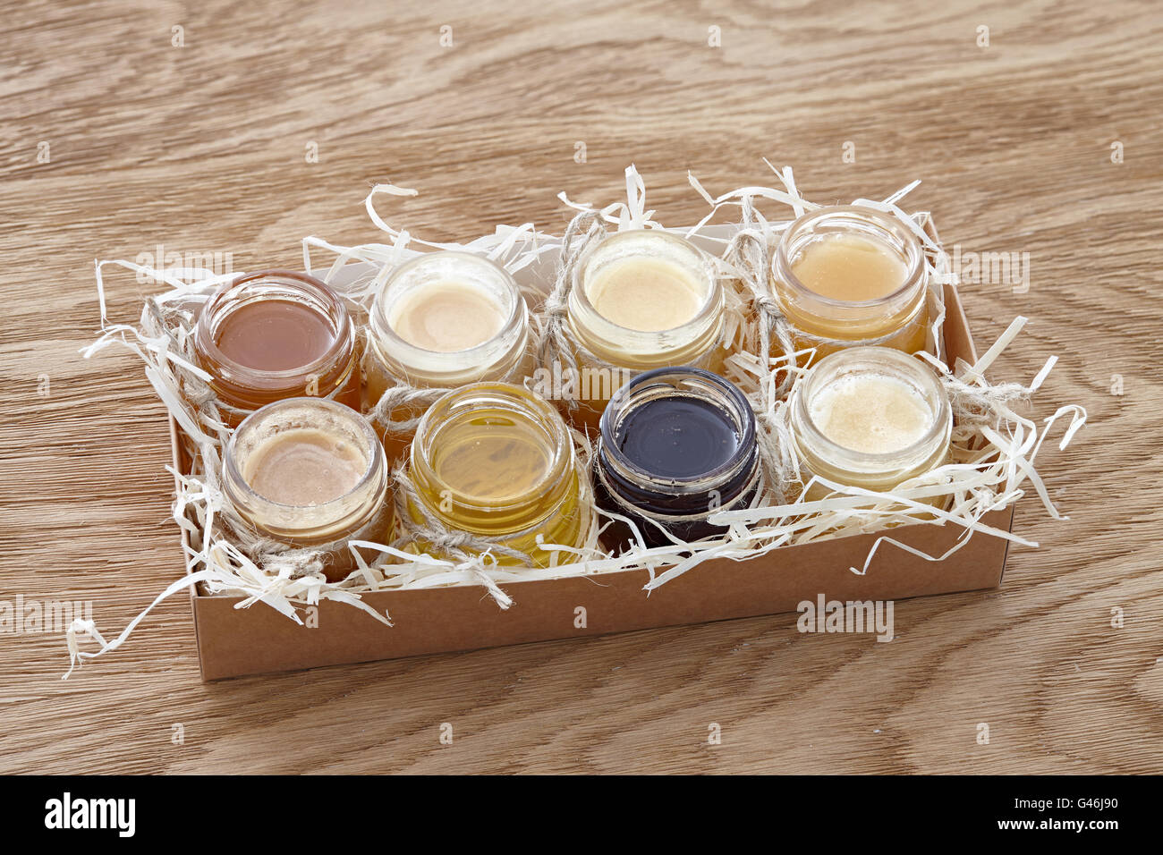 Different kinds of honey in a box Stock Photo - Alamy