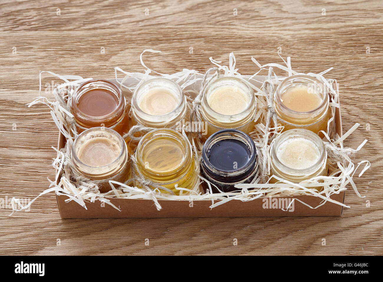 Different kinds of honey in a box Stock Photo - Alamy