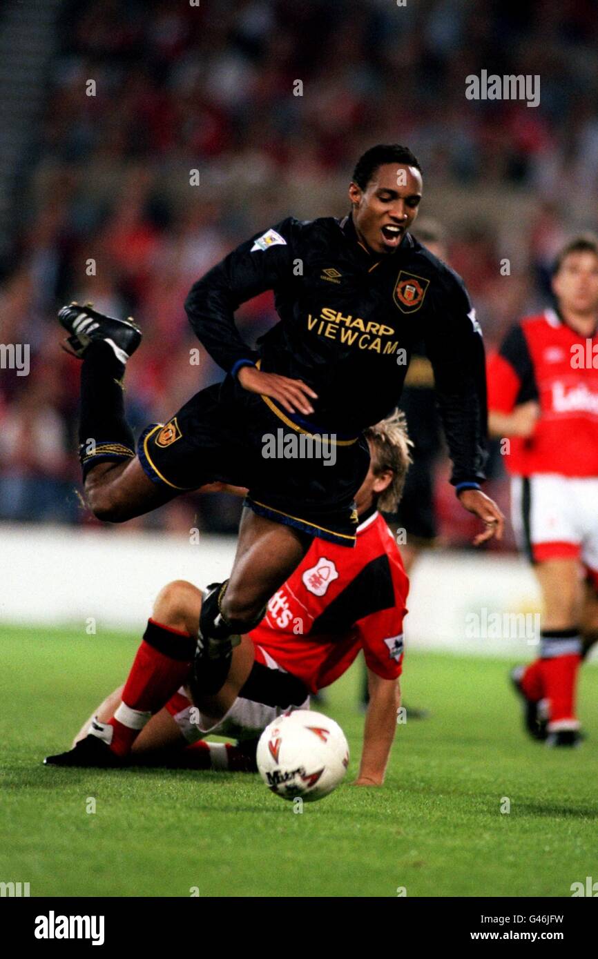 Nottingham Forest's Stuart Pearce, sends Manchester United's Paul Ince ...
