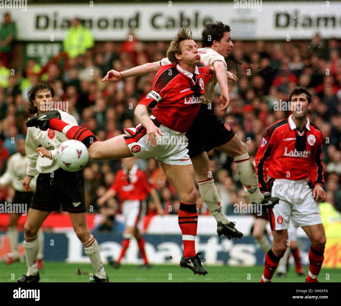 Nottingham Forest's Stuart Pearce in a mid-air collision with Liverpool ...