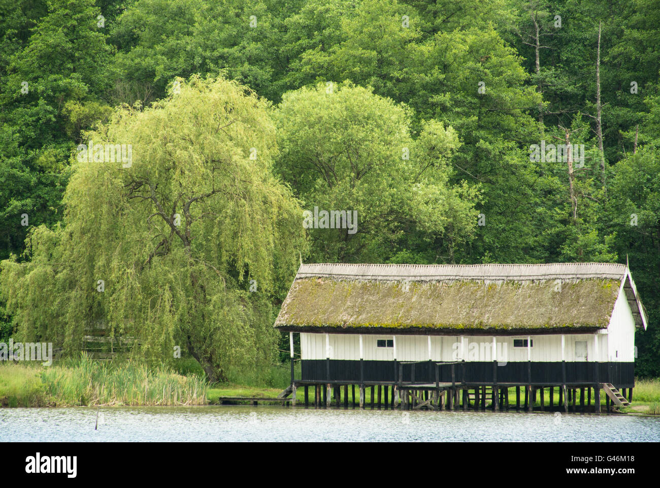 Traditional Fisher House On The Lake Shore Stock Photo - Alamy