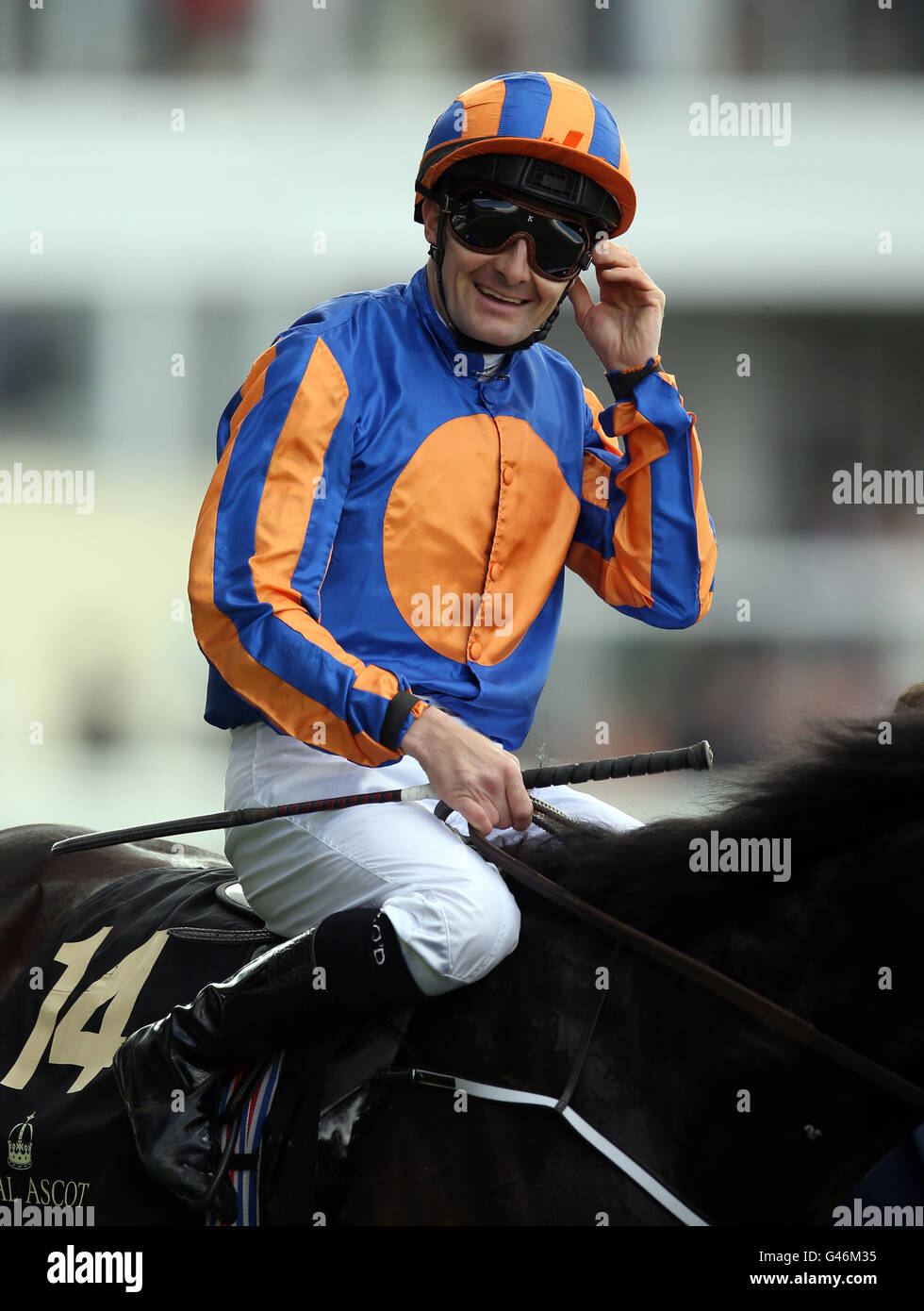 Jockey Colm O'Donoghue celebrates winning the Queen's Vase onboard ...