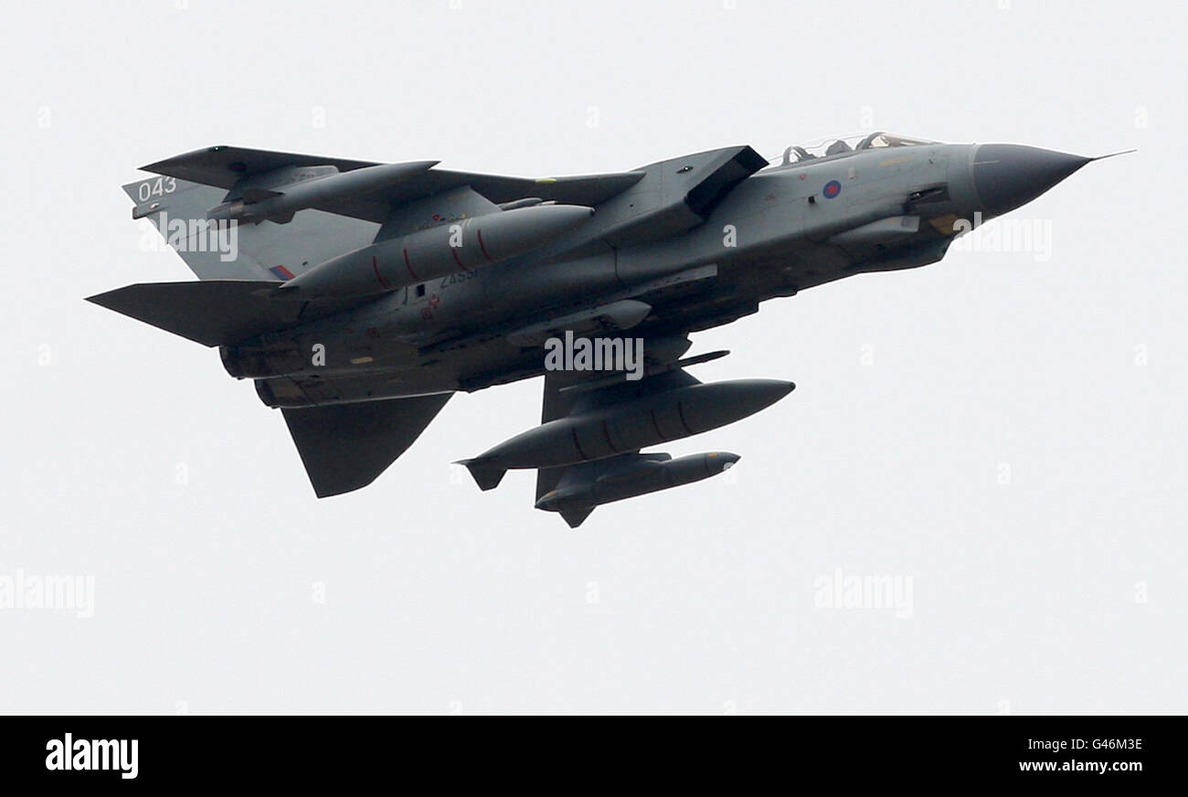 An RAF Tornado aircraft flies over RAF Marham, in Norfolk, before ...
