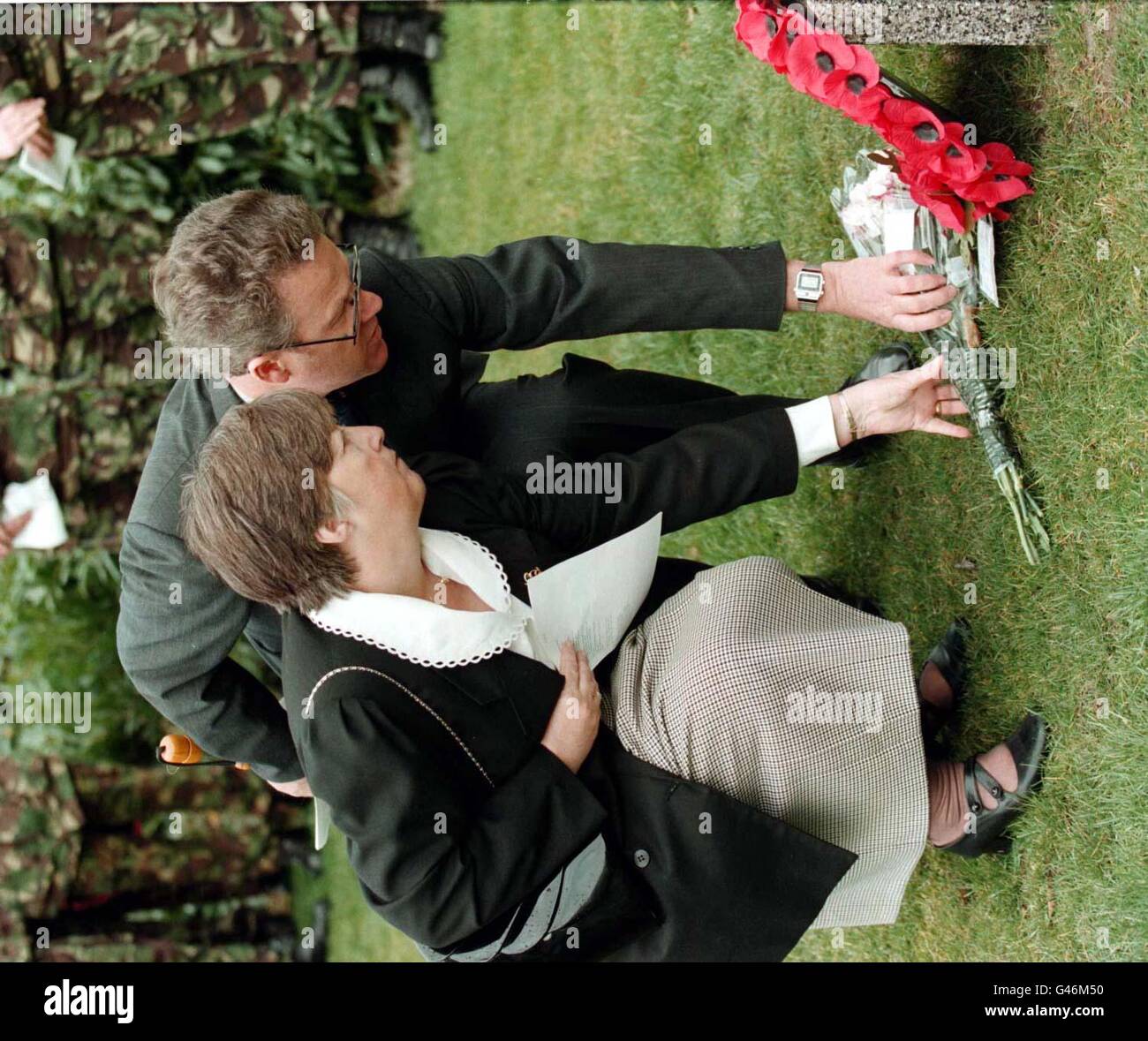 John and Rita Restorick leave flowers at a memorial stone in memory of ...