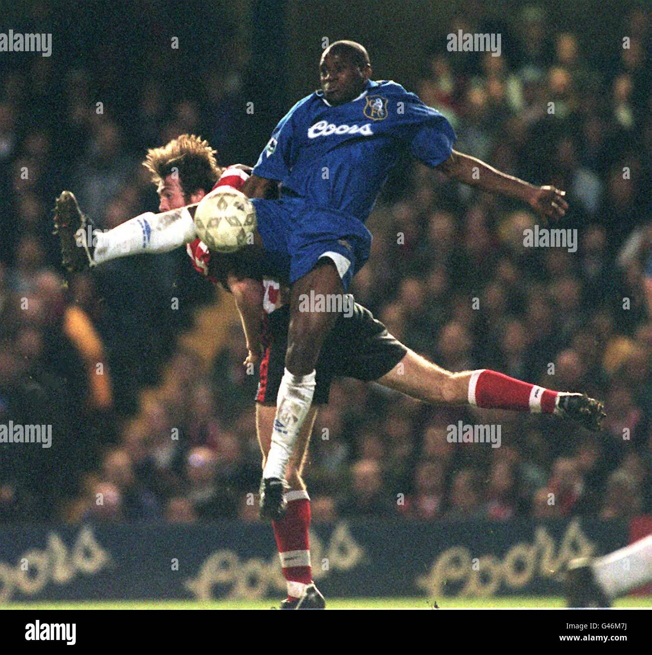 Chelsea's Frank Sinclair gets to the ball ahead of Southampton's Eyal ...