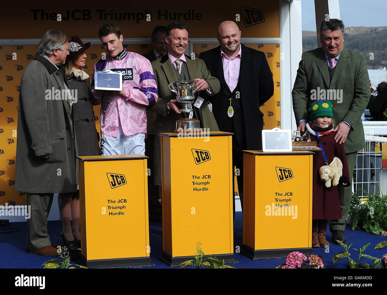Jockey Daryl Jacob (third left) and trainer Paul Nicholls (far right ...