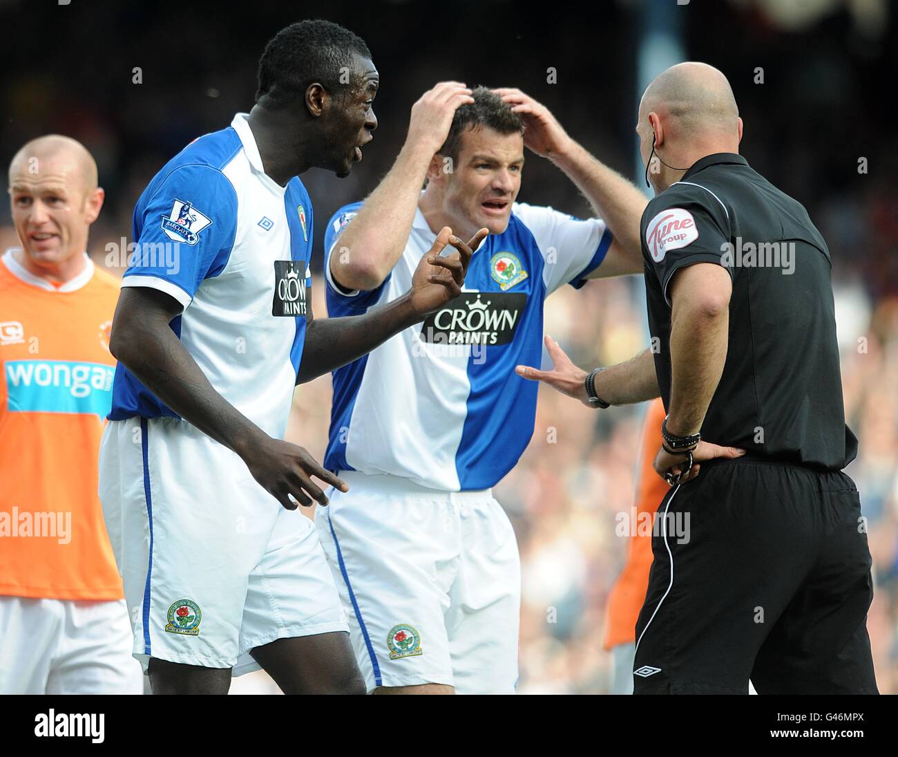 Referee Howard Webb (right) argues with Blackburn Rovers' Ryan Nelsen ...