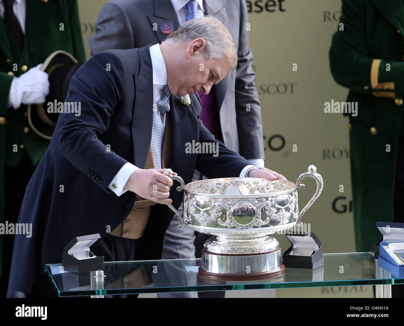 The Duke of York looks at the Coronation stakes trophy during day four ...
