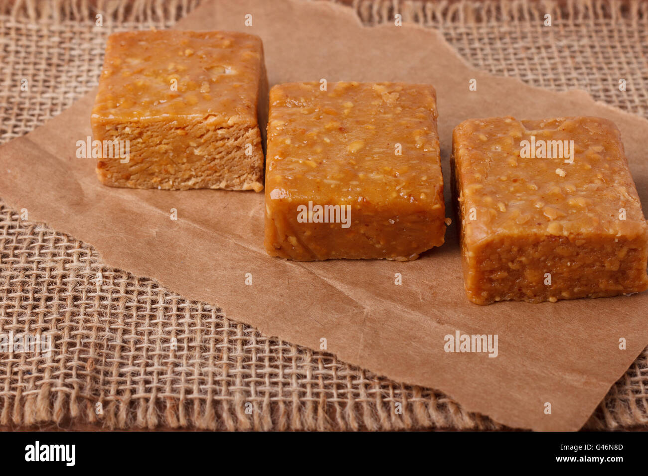 Pacoca - brazilian candy of ground peanut on wooden background ...