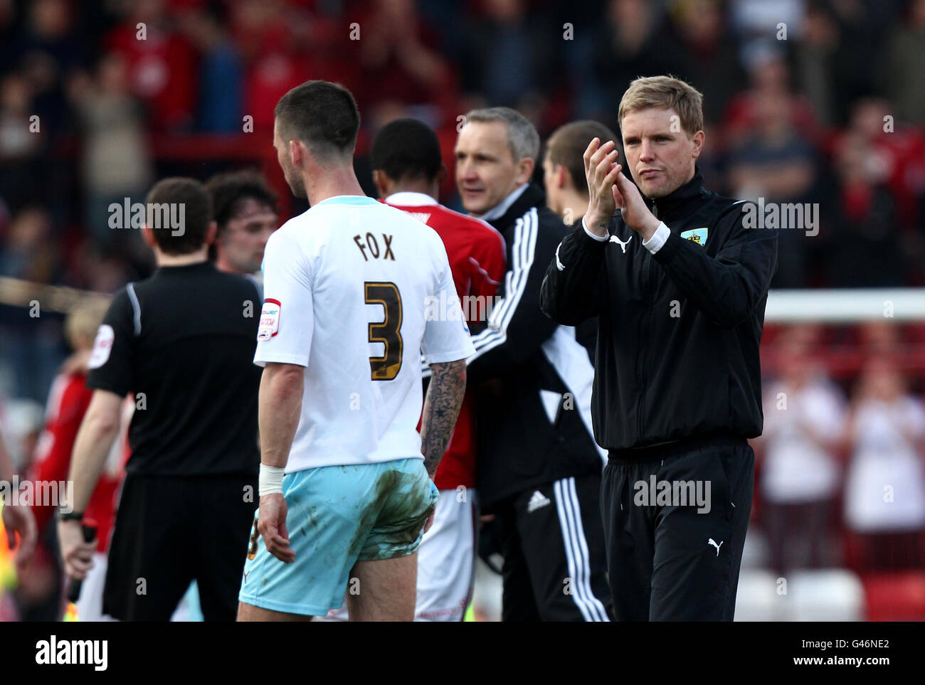 Burnley's manager Eddie Howe applauds the away fans at the end of the ...