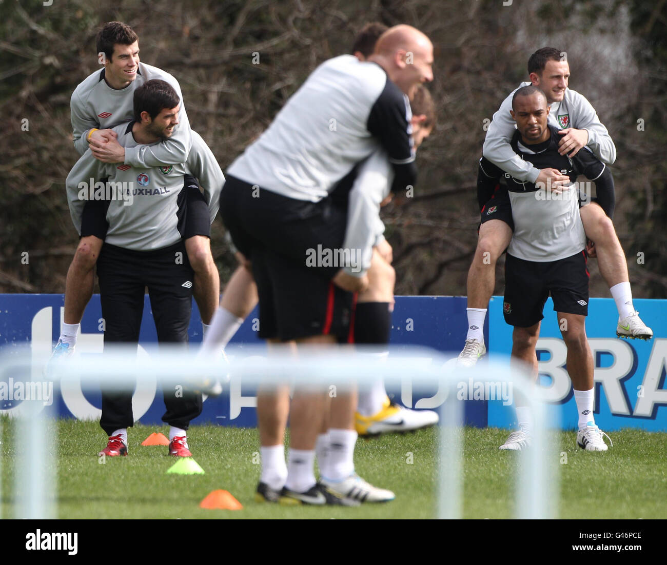 Wales' Gareth Bale (left) on the back of Joe Ledley with and Danny ...