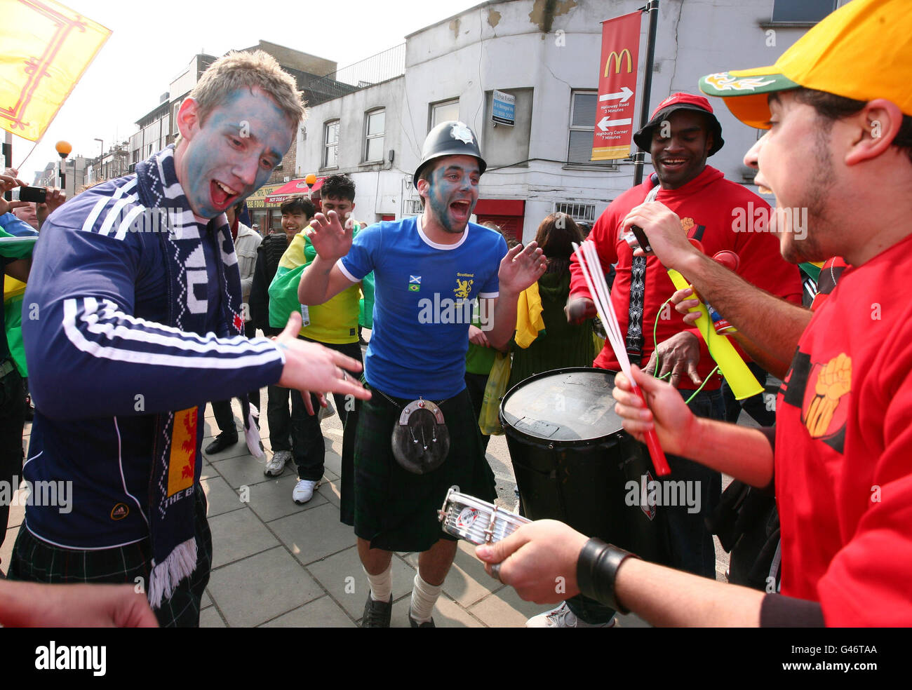 Scottish football fans have fun with a Brazilian band before Scotland's ...