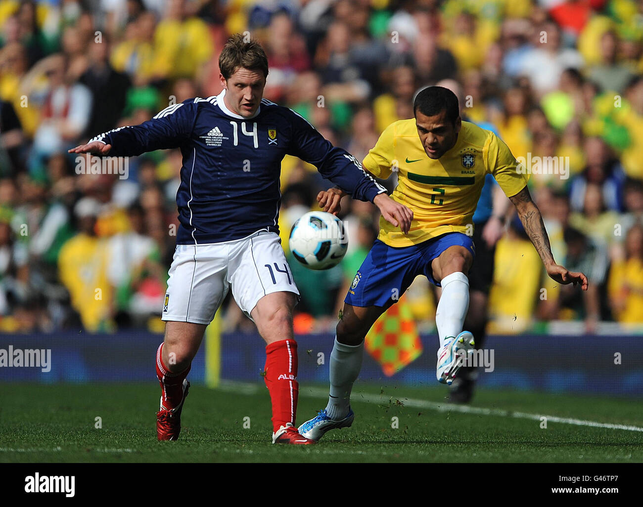 Scotland's Kris Commons and Brazil's Daniel Alves (right) in action ...