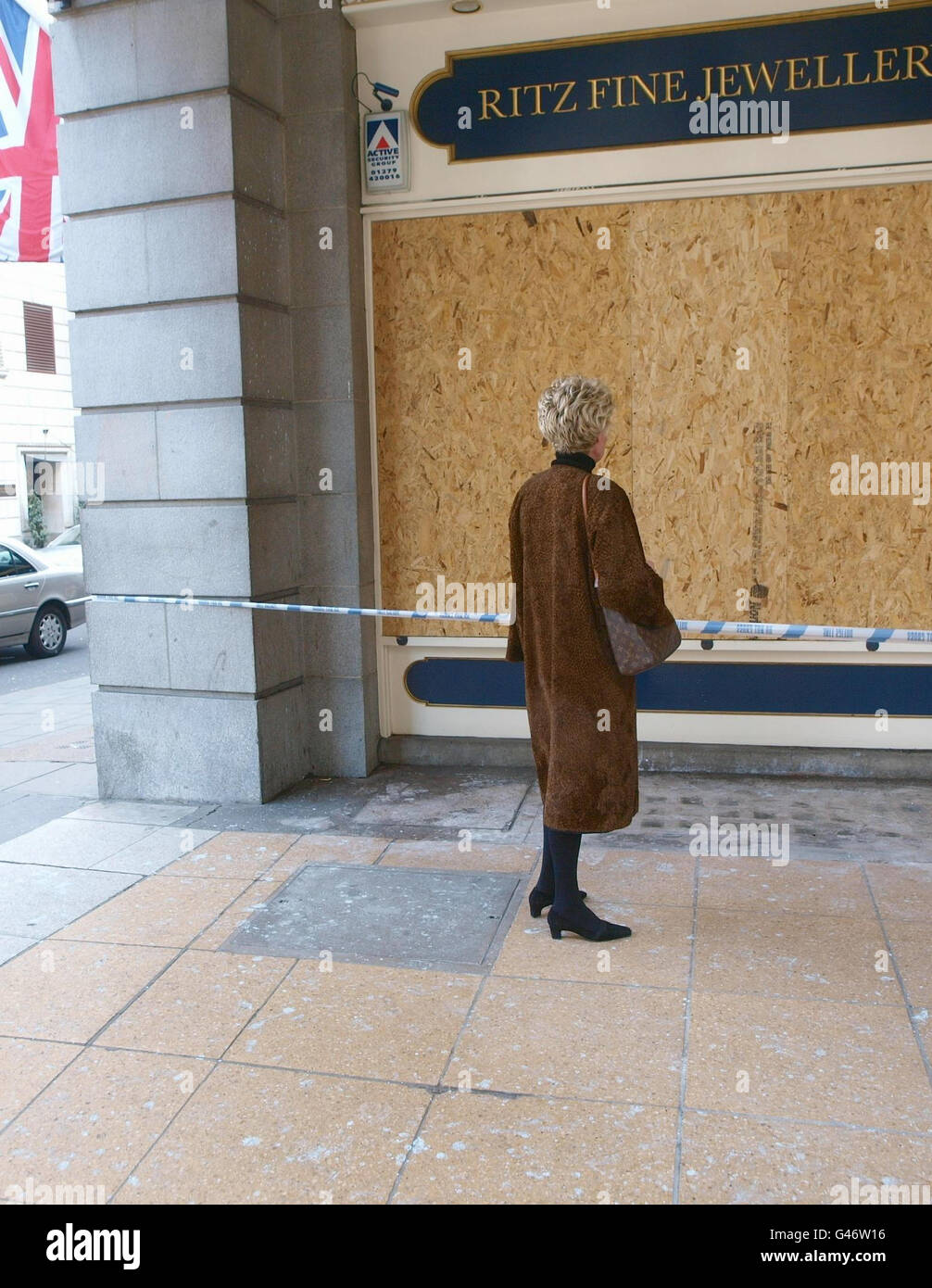 A pedestrian looks at the damage to London's Ritz Hotel, after ...