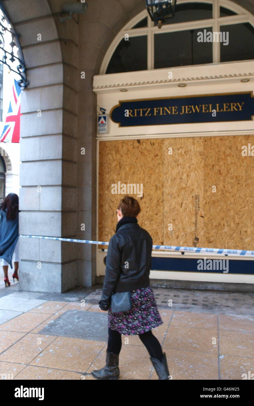 Pedestrians walk past the damage to London's Ritz Hotel, after ...