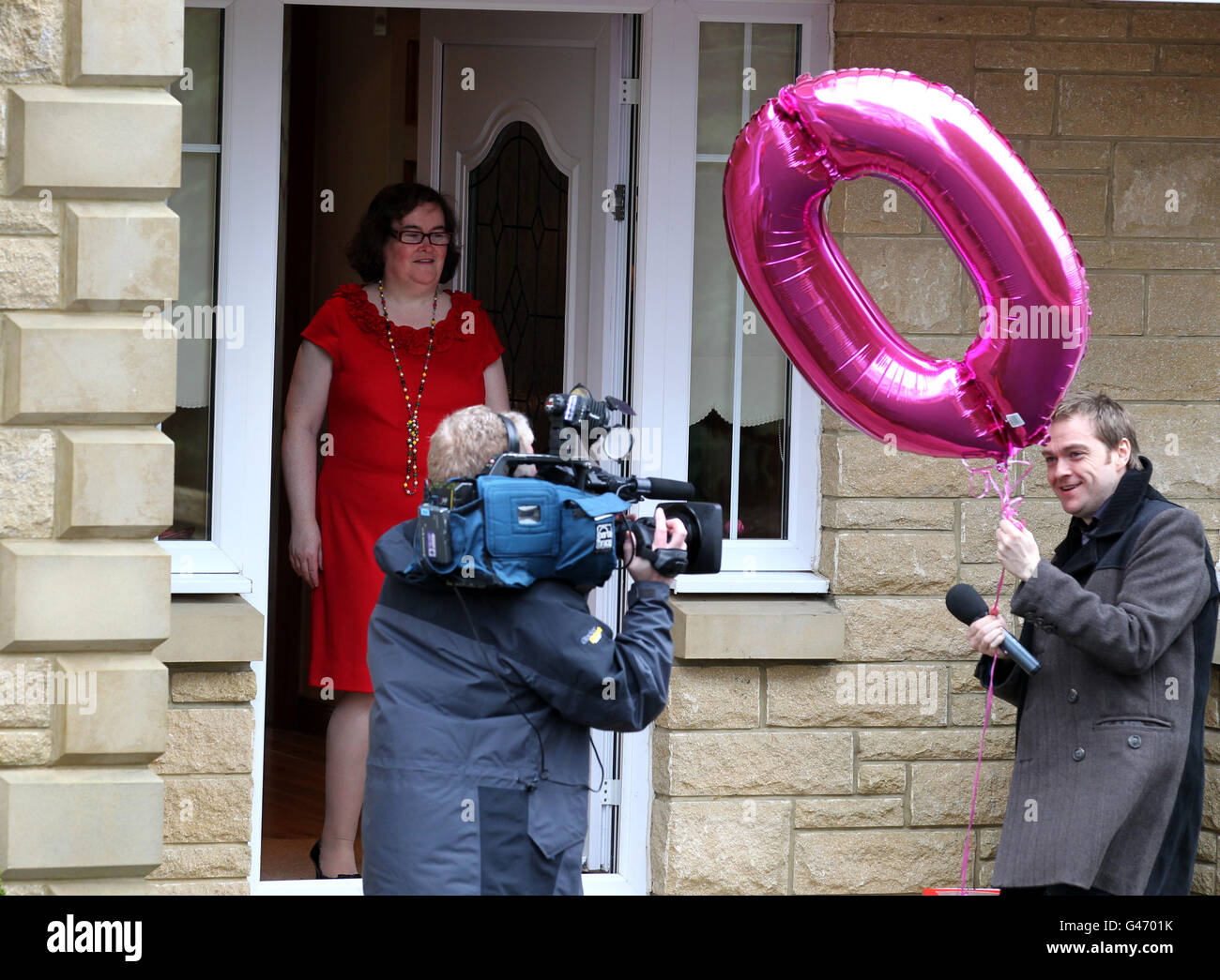 A TV presenter interviews singer Susan Boyle as she celebrates turning ...