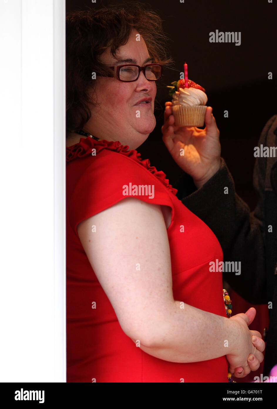 A TV presenter interviews singer Susan Boyle as she celebrates turning ...