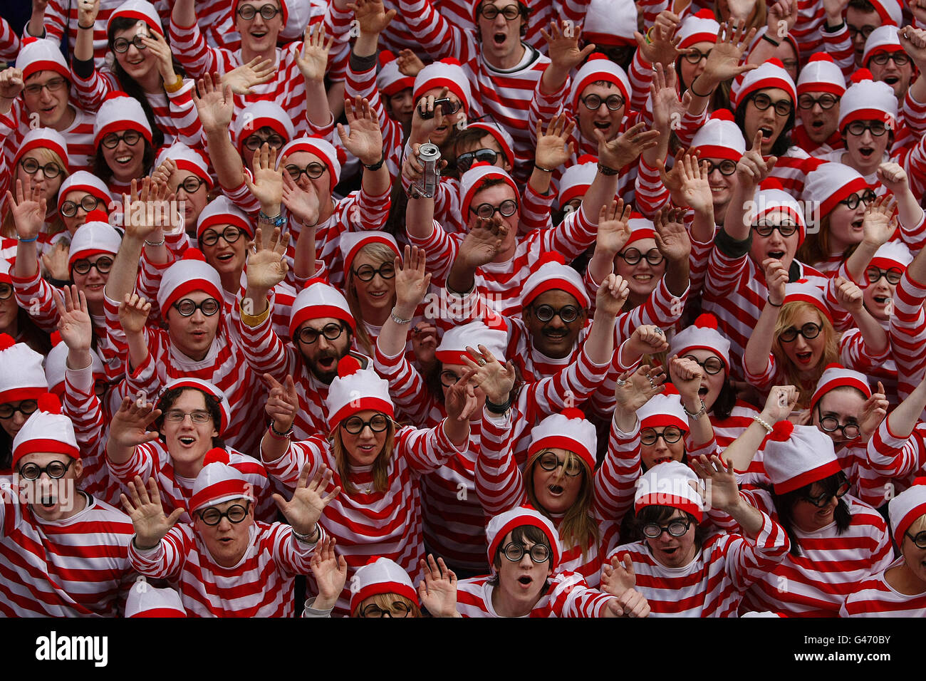 A crowd of people dressed as 'Where's Wally' in Dublin, for the launch ...