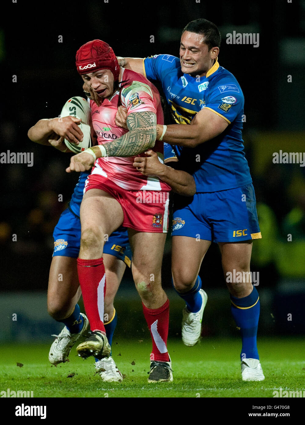 Wigan's Harrison Hansen is tackled by Leeds' Weller Hauraki during the ...