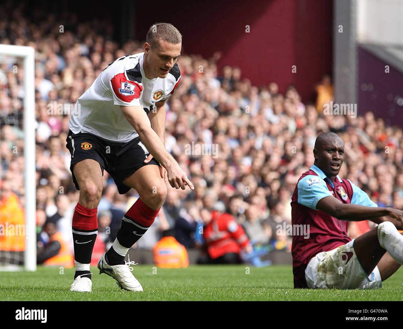 Manchester united's nemanja vidic (left) points to the spot outside of ...