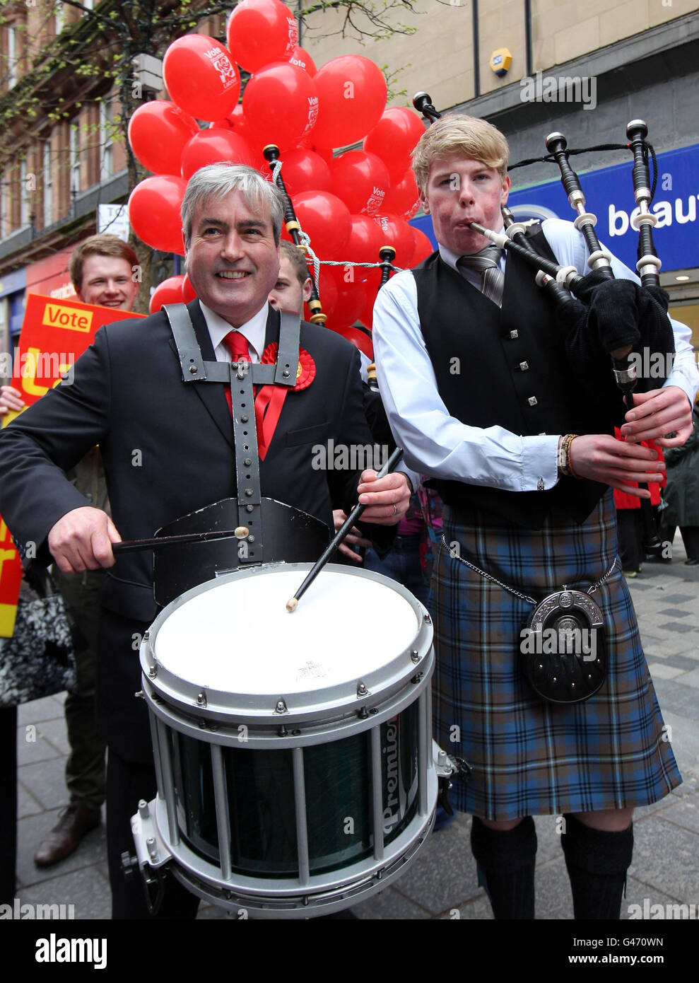 Scottish Labour leader Iain Gray attempts to play the drums with the ...
