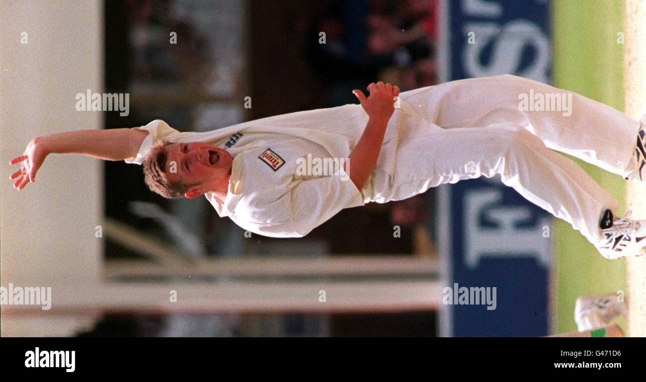 Fighting back, England bowler Robert Croft shows his delight as he ...