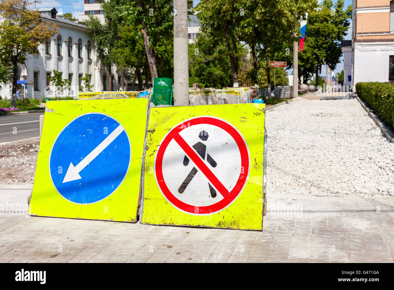 Road signs at the under construction sidewalk in summer day Stock Photo ...