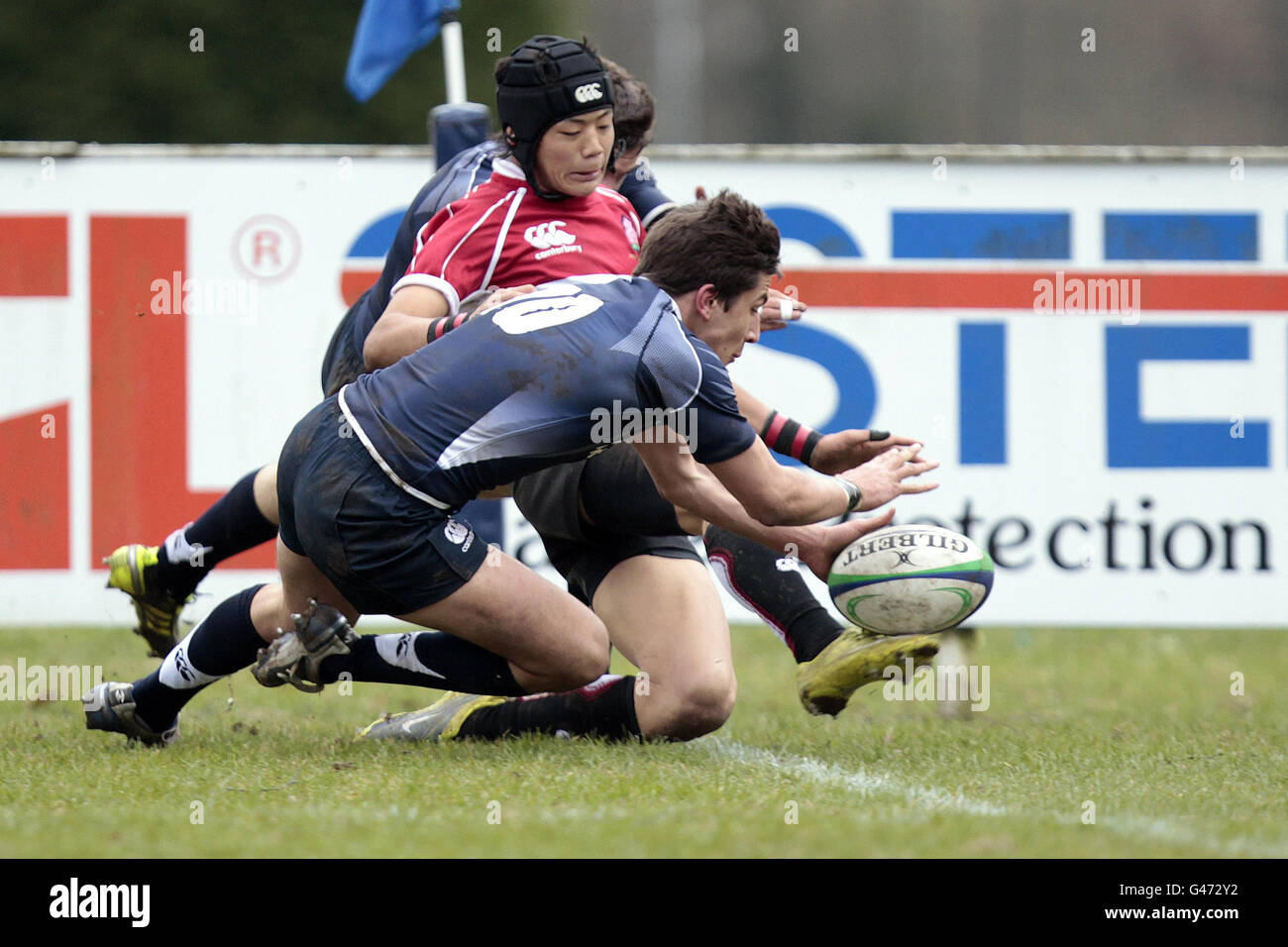 Scotland under-18's Tommy Allan (right) scores a try during the match ...