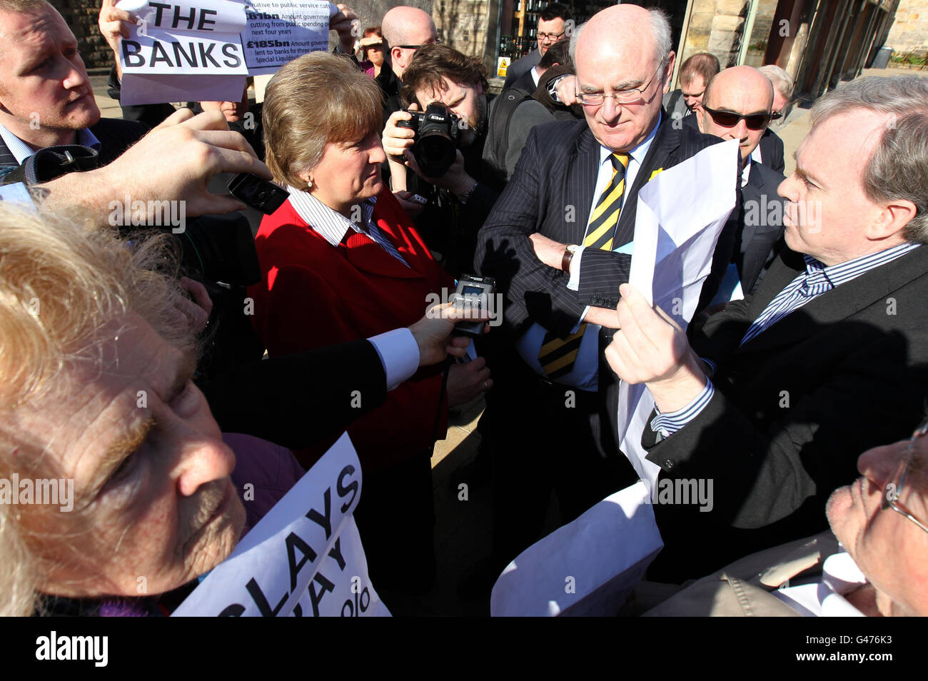 Scottish Conservatives leader Annabel Goldie is met by cuts protester ...