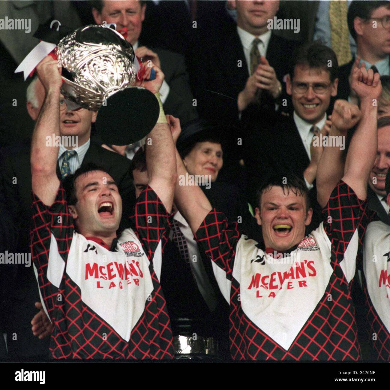 St Helens' captain Chris Joynt (holding trophy) celebrates with Tommy ...