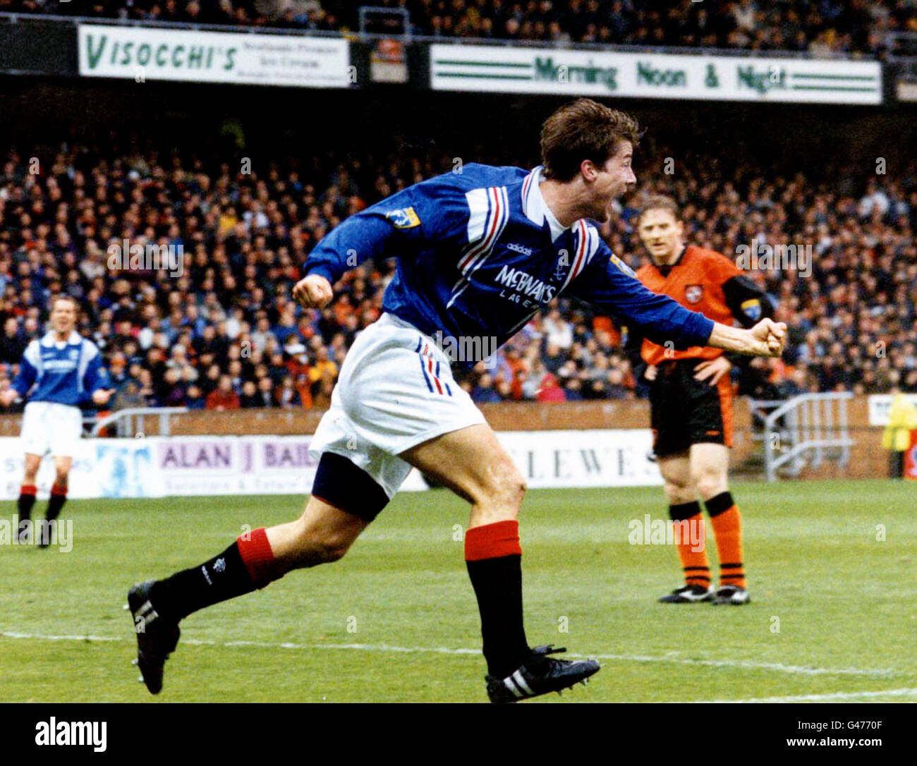 Ranger's Danish star Brian Laudrup celebrates his goal during his sides ...