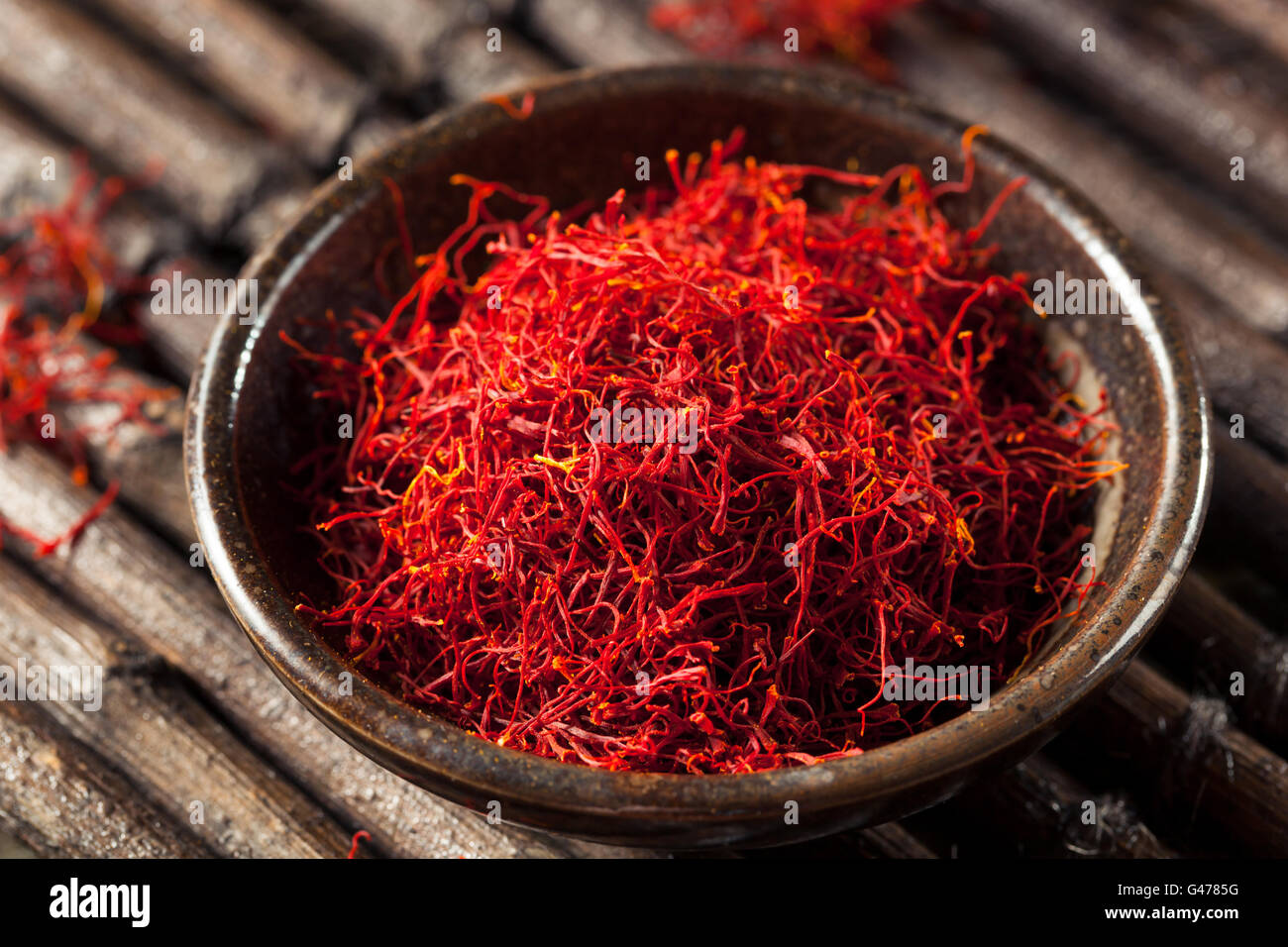 Raw Organic Red Saffron Spice in a Bowl Stock Photo - Alamy