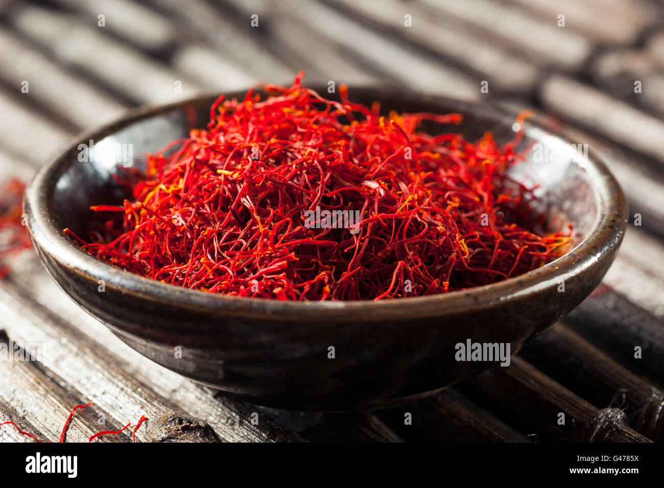Raw Organic Red Saffron Spice in a Bowl Stock Photo - Alamy