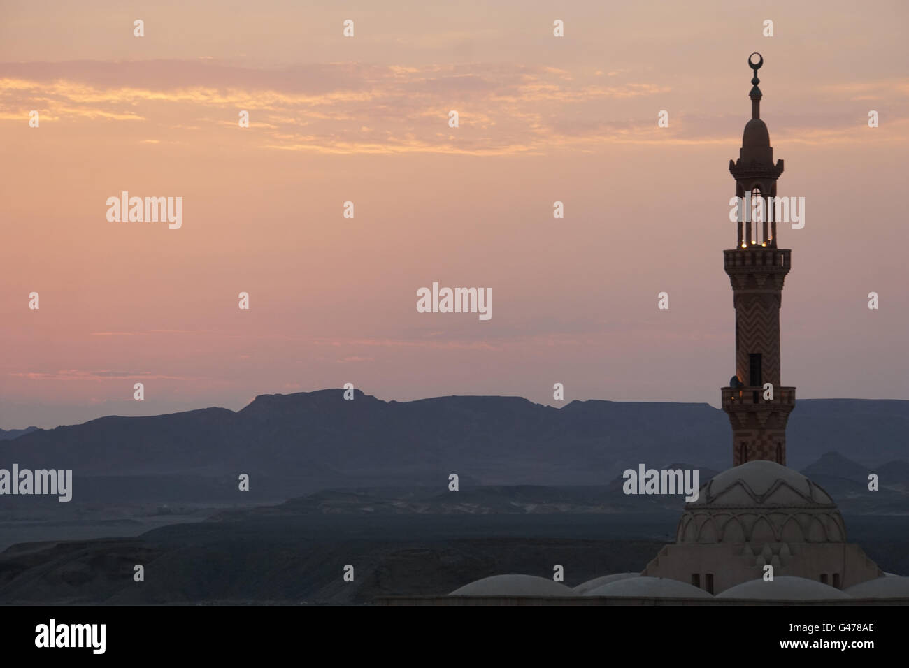 sunset over mosque in egypt town of el quesir Stock Photo - Alamy