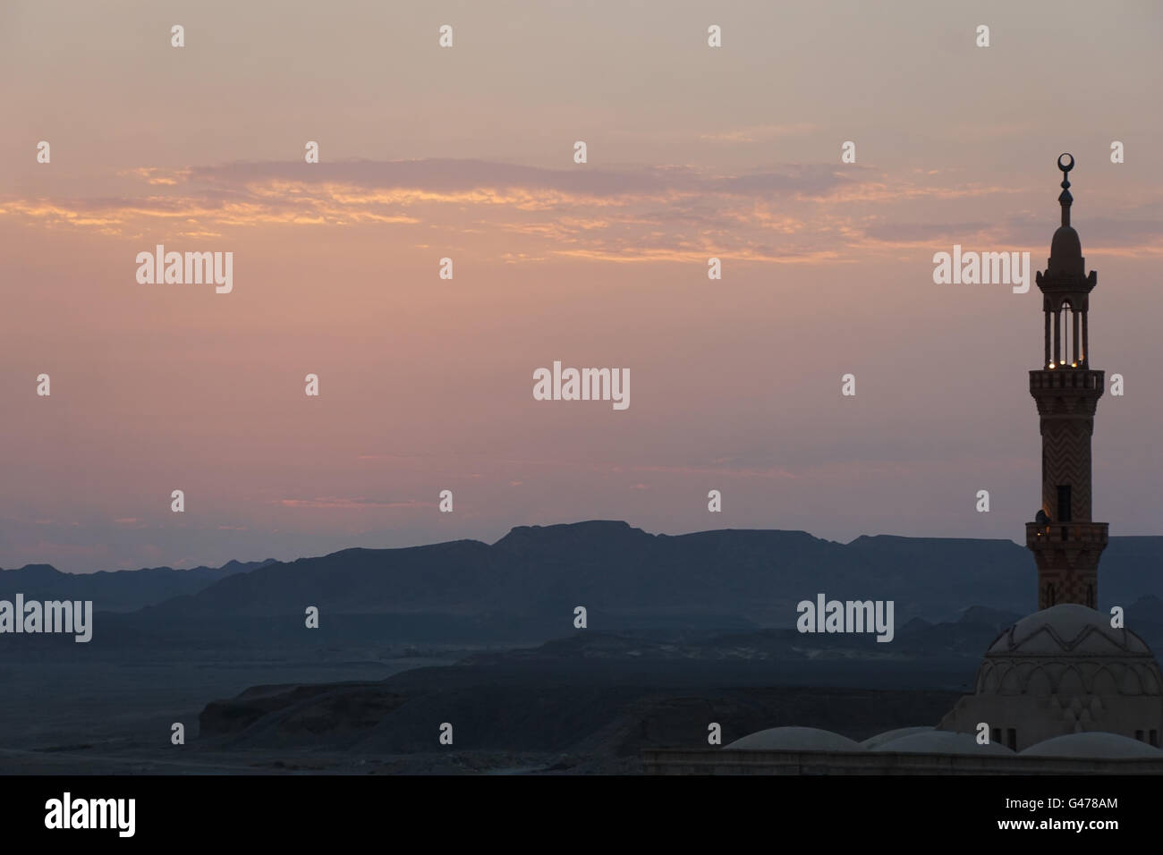 sunset over mosque in egypt town of el quesir Stock Photo - Alamy