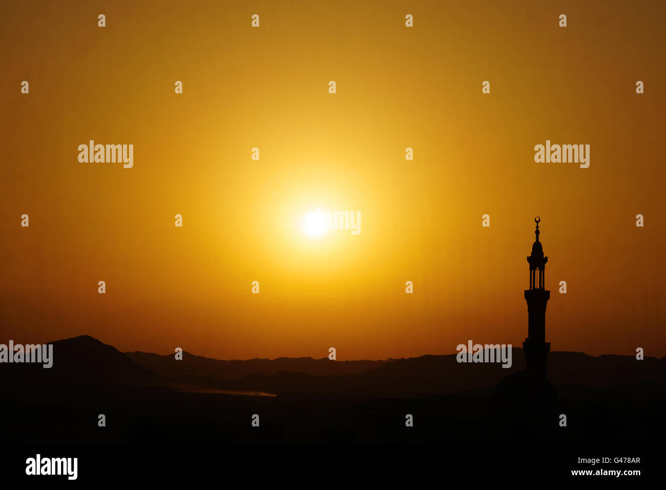 sunset over mosque in egypt town of el quesir Stock Photo - Alamy