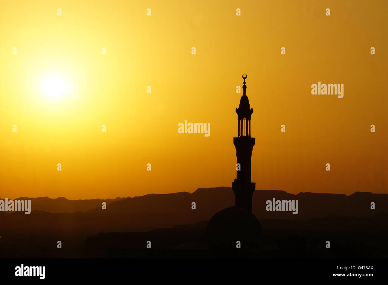 sunset over mosque in egypt town of el quesir Stock Photo - Alamy