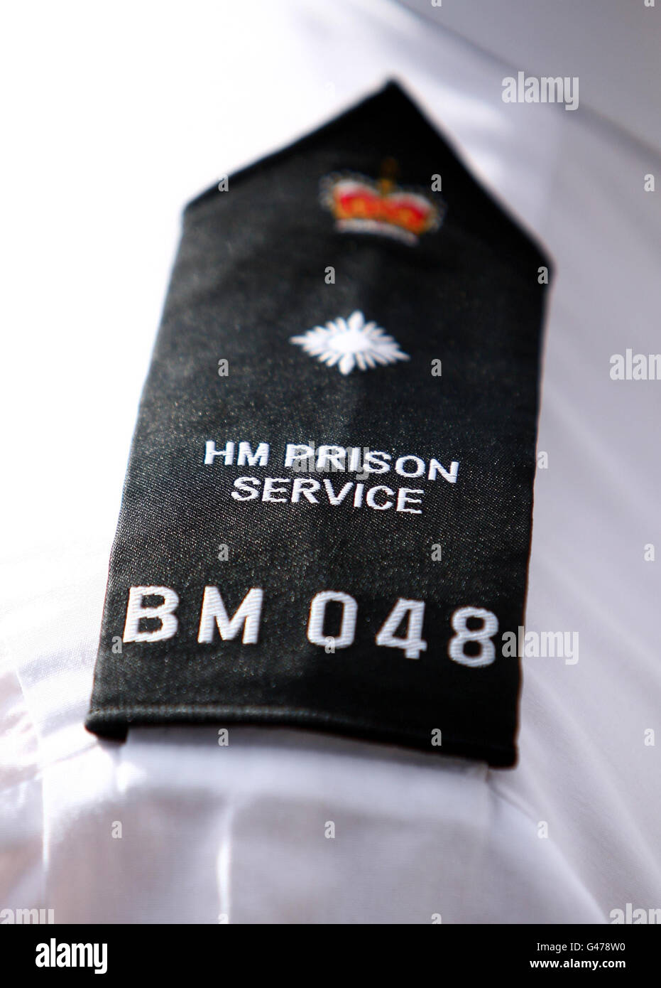 A close up of an epaulette on the shoulder of a prison officer outside ...
