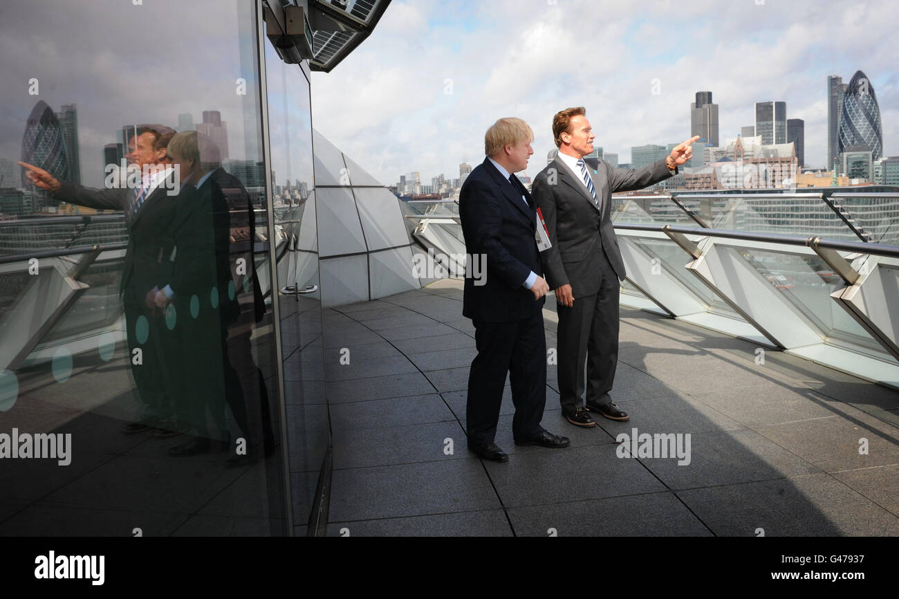 London Mayor Boris Johnson (left) shows the former Governor of ...