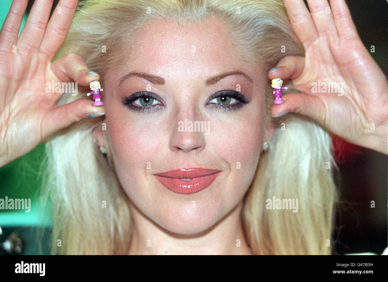 TV presenter/model Tamara Beckwith, holds up a Polly Pocket miniature ...