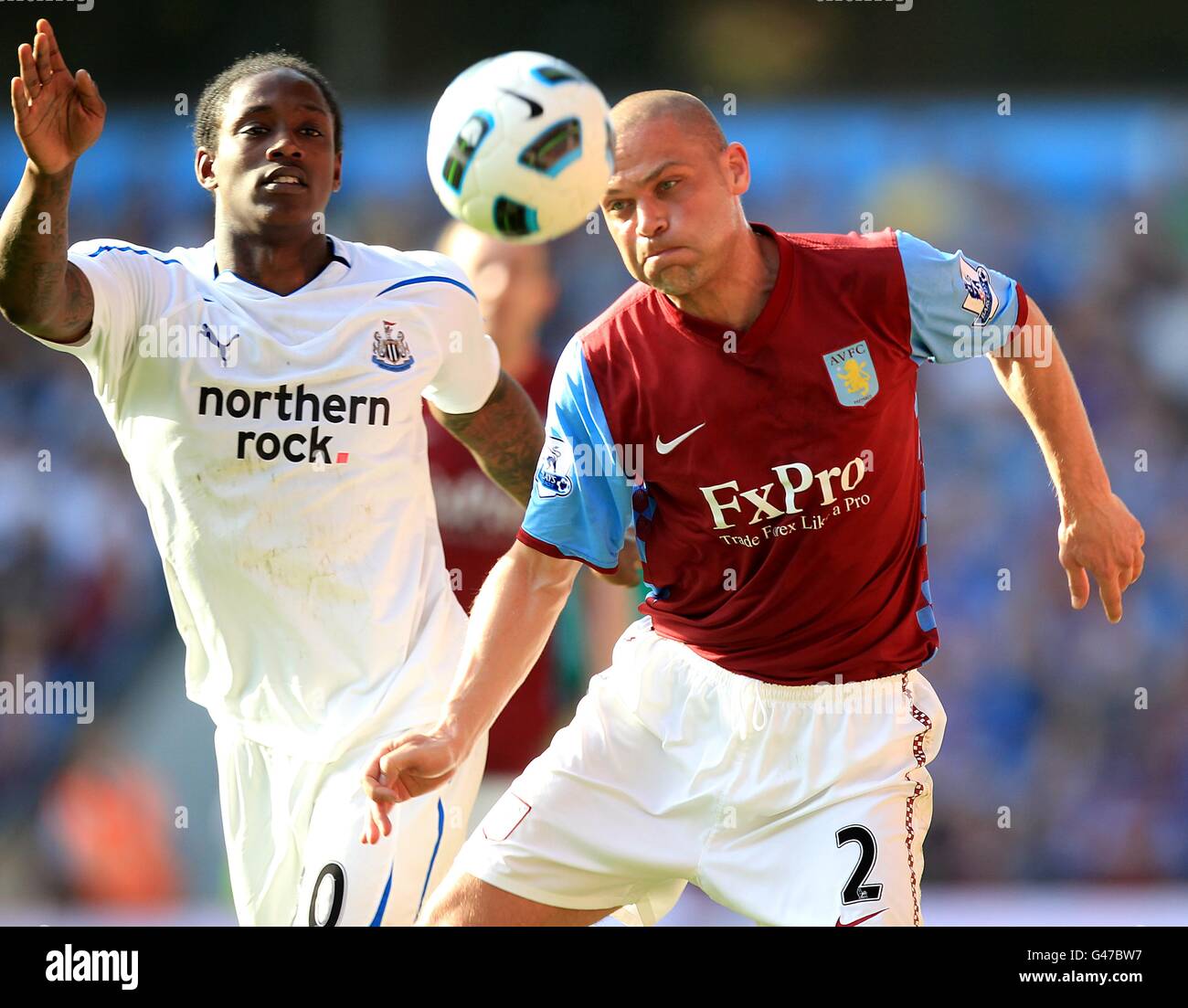 Newcastle United's Nile Ranger (left) and Aston Villa's Luke Young ...