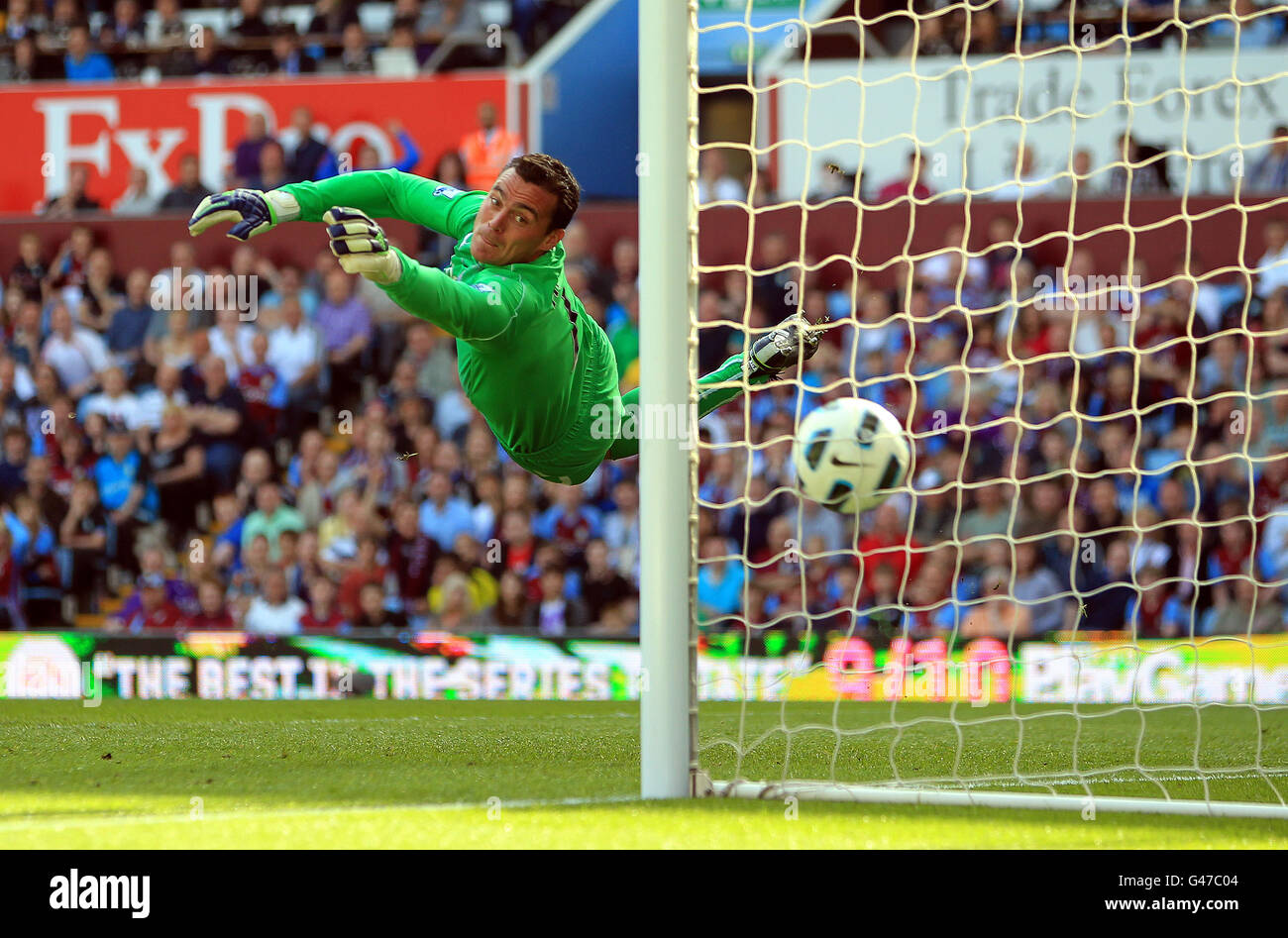 Newcastle goalkeeper steve harper dives hi-res stock photography and ...