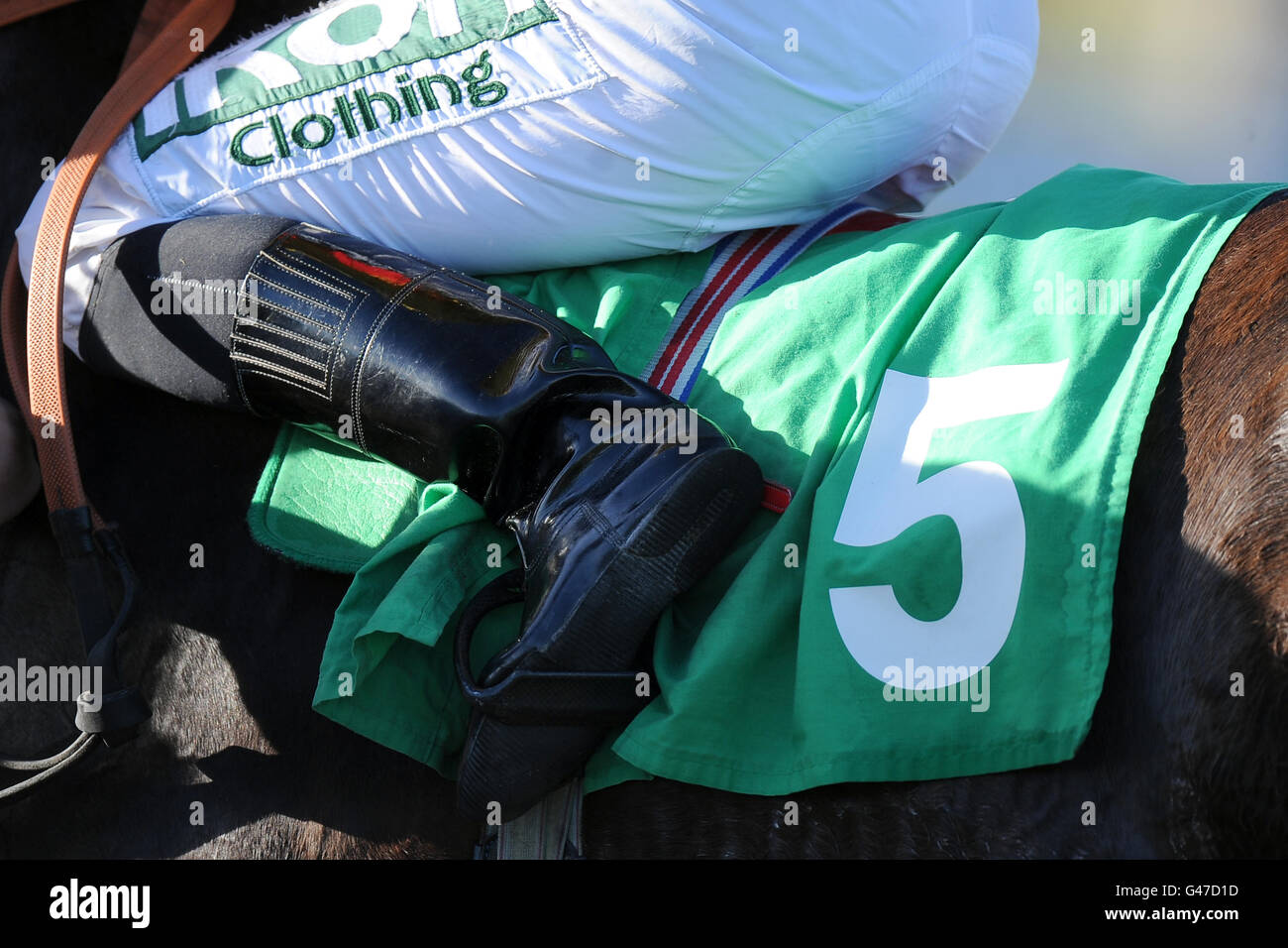 Detail of a jockey and saddle cloth on a ride hi-res stock photography ...