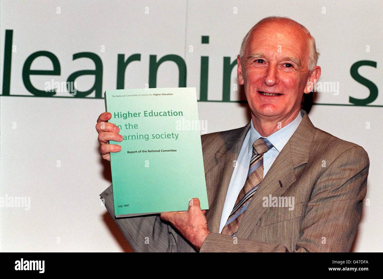Sir Ron Dearing with the report compiled from a year-long inquiry ...