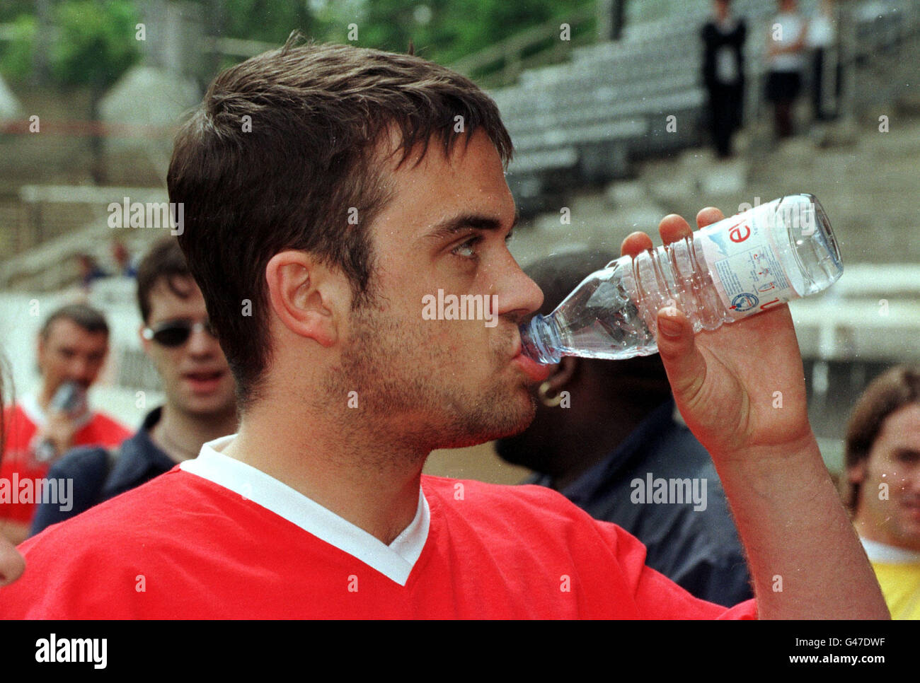ROBBIE WILLIAMS/soccer SIX 97. ROBBIE WILLIAMS TAKES A DRINK DURING THE ...