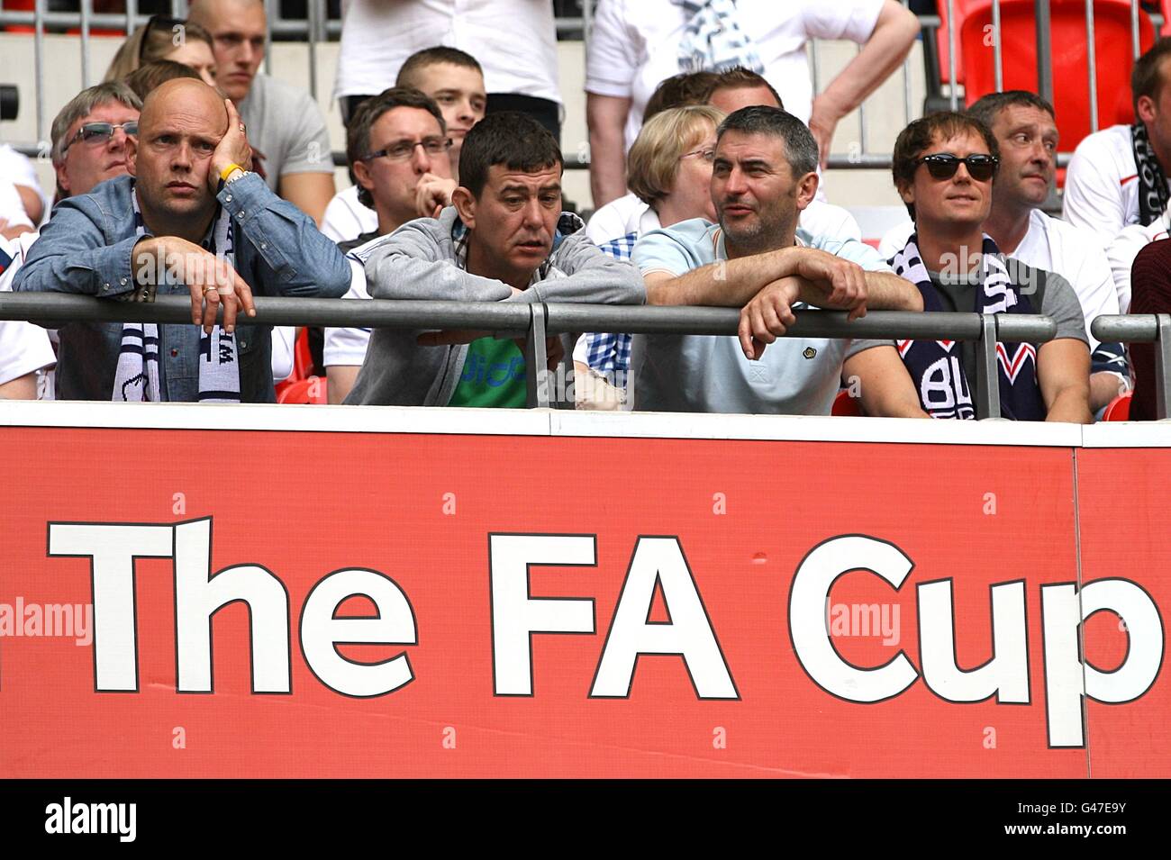 Shell-shocked Bolton Wanderers fans look on in the stands, as their ...