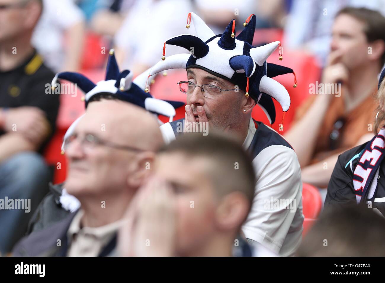 Shell-shocked Bolton Wanderers fans look on in the stands, as their ...
