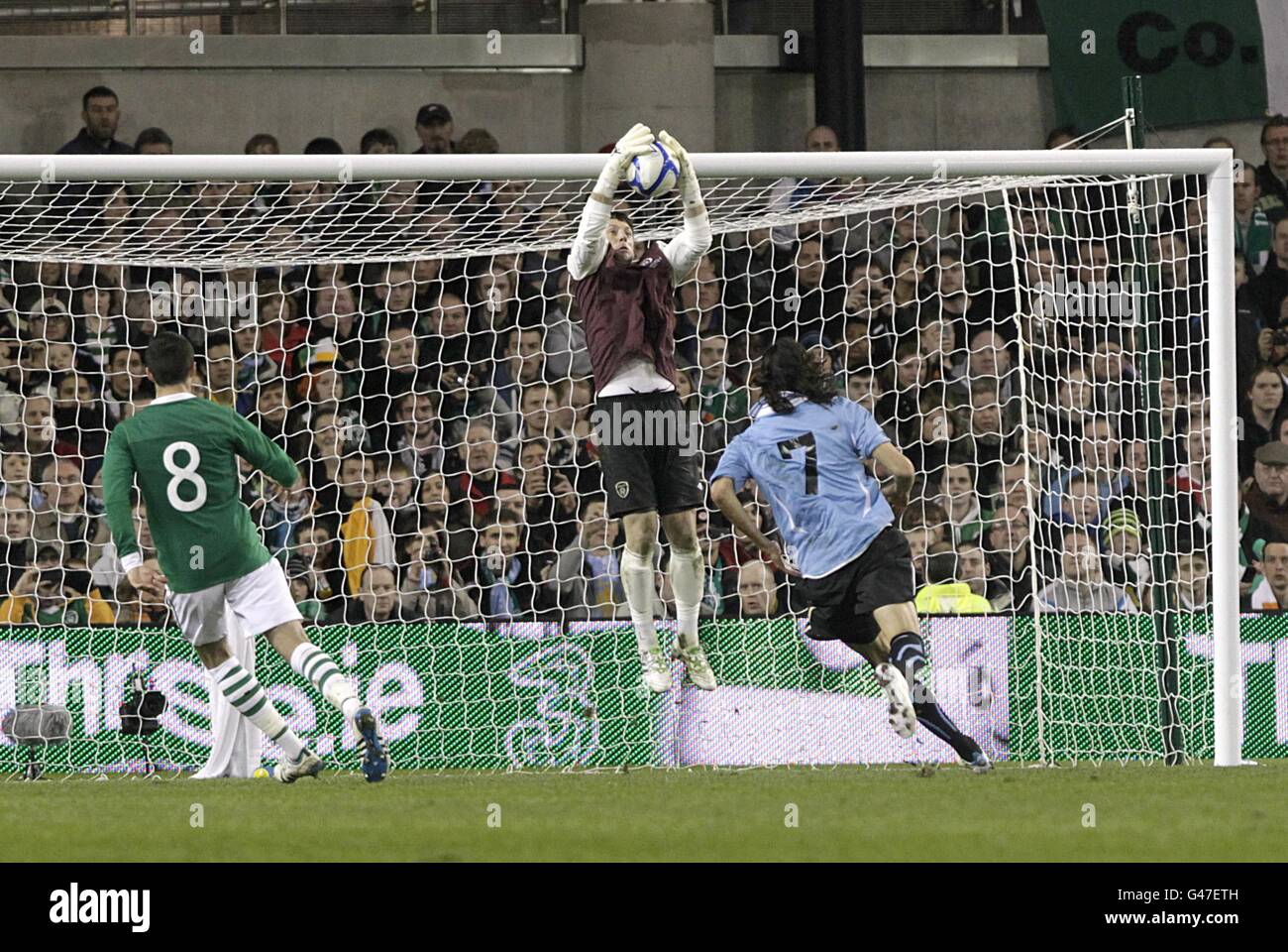 Republic of Ireland goalkeeper Kieren Westwood (centre) saves a free ...